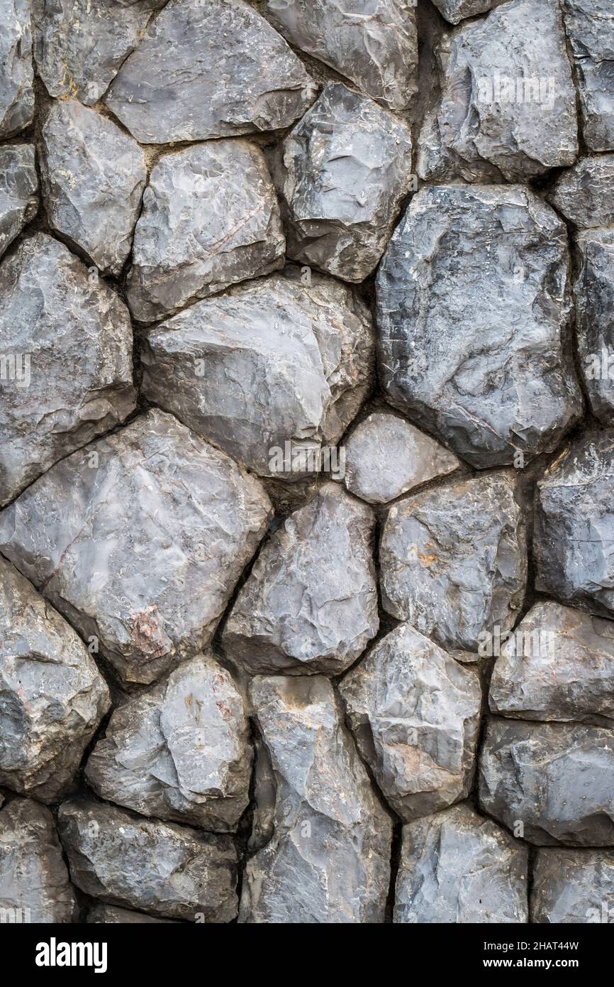 Old stone rock wall use for background Stock Photo - Alamy