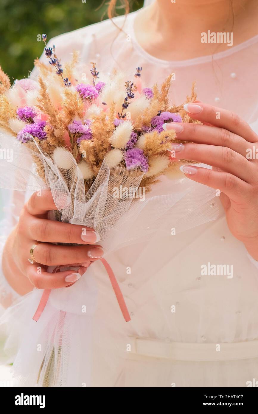 Weeding flowers background in hands. Bride holding her weeding bouquet ...