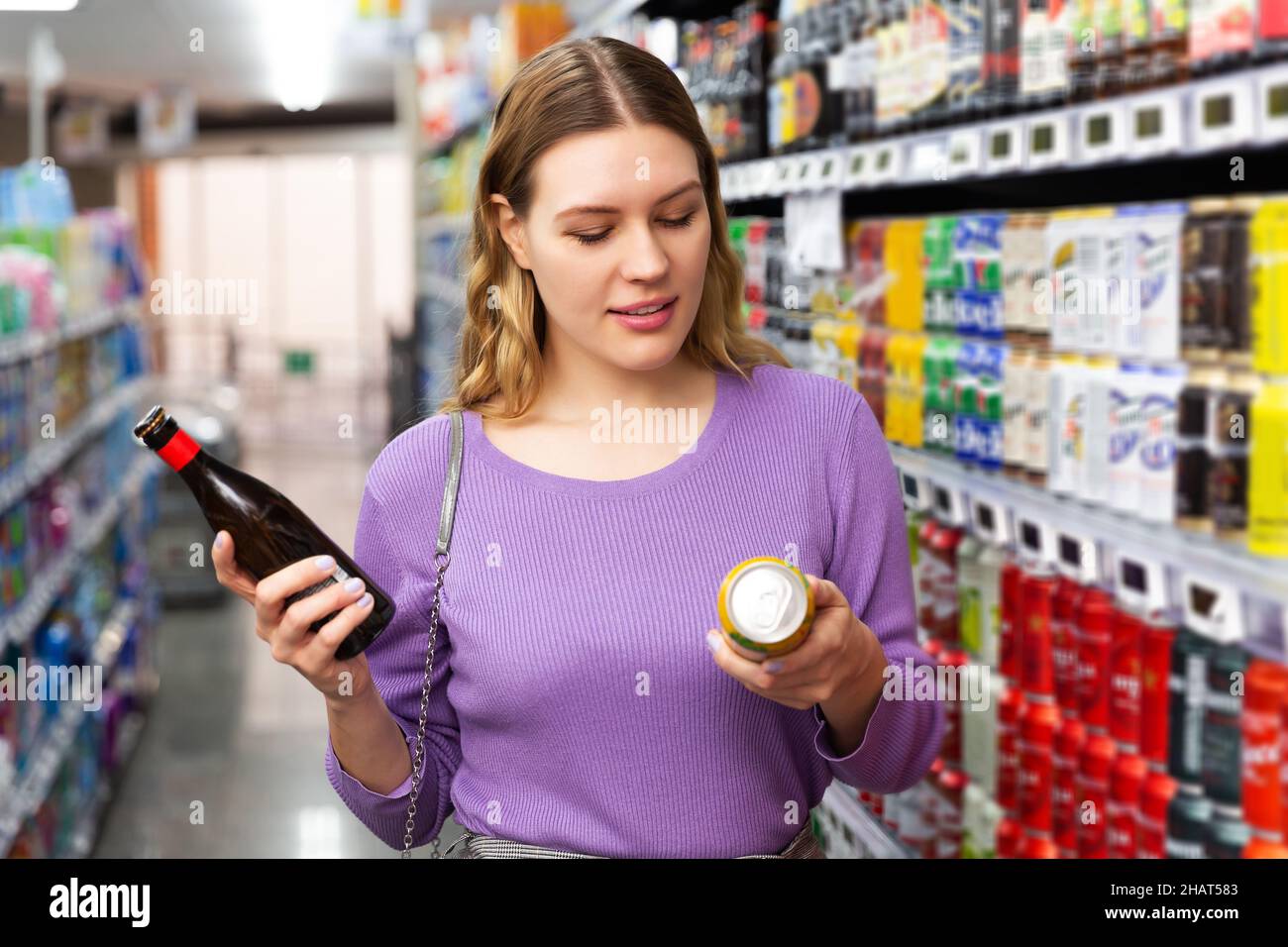 woman customer buying bottle of beer in the supermarket Stock Photo - Alamy