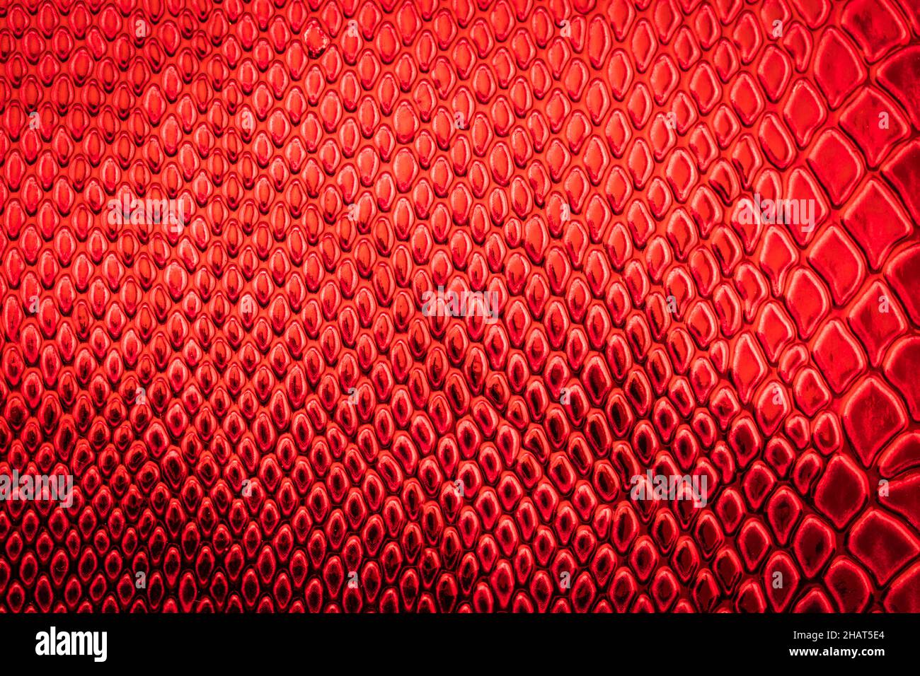Red exotic Snake skin pattern as a wallpaper Stock Photo - Alamy