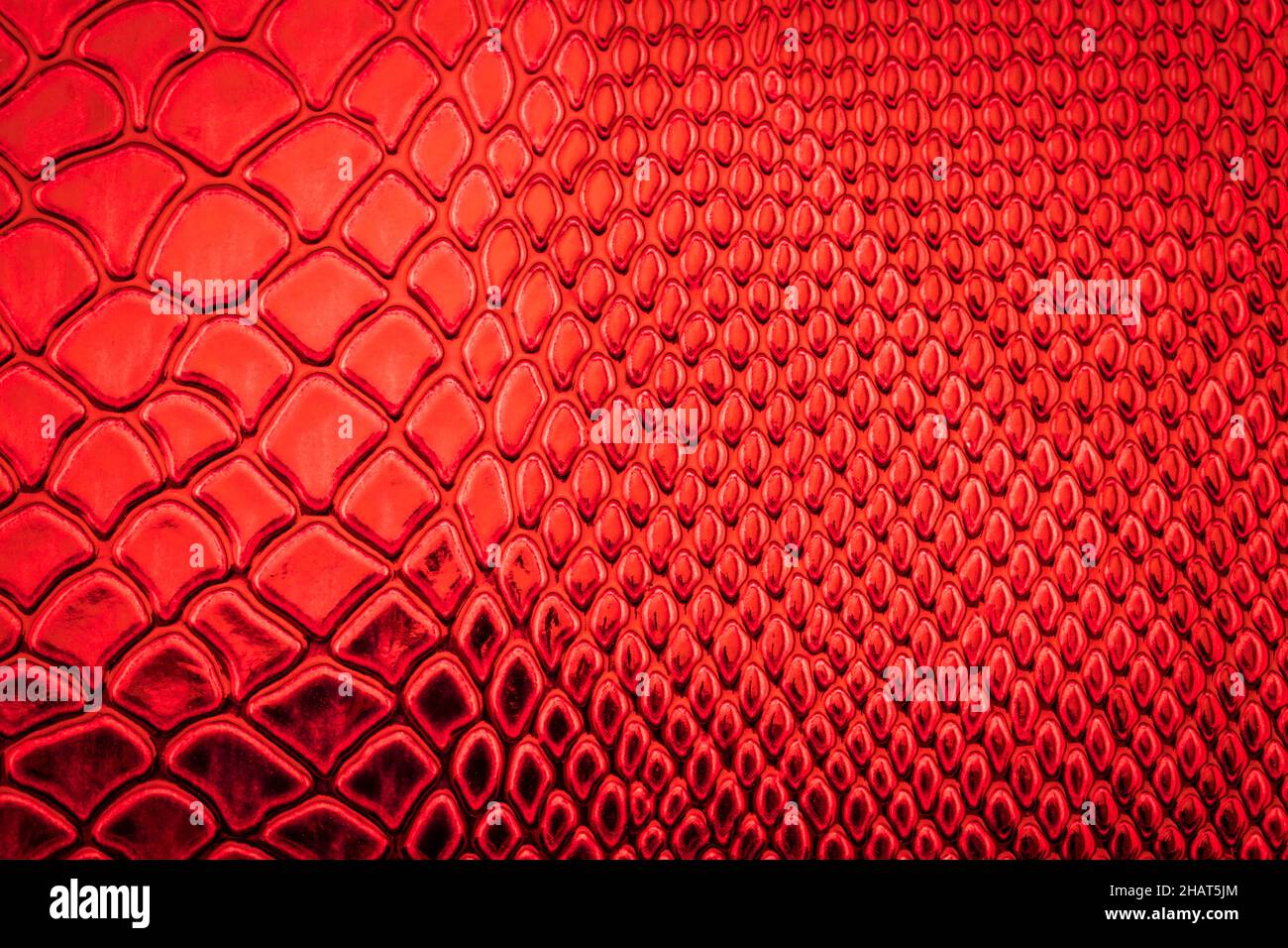 Red exotic Snake skin pattern as a wallpaper Stock Photo - Alamy