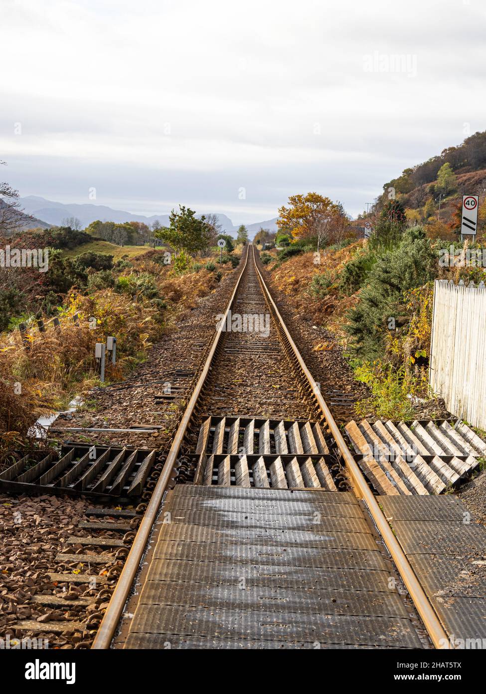 Railway line from Kyle of Lochalsh to Inverness crossing the A890 at ...