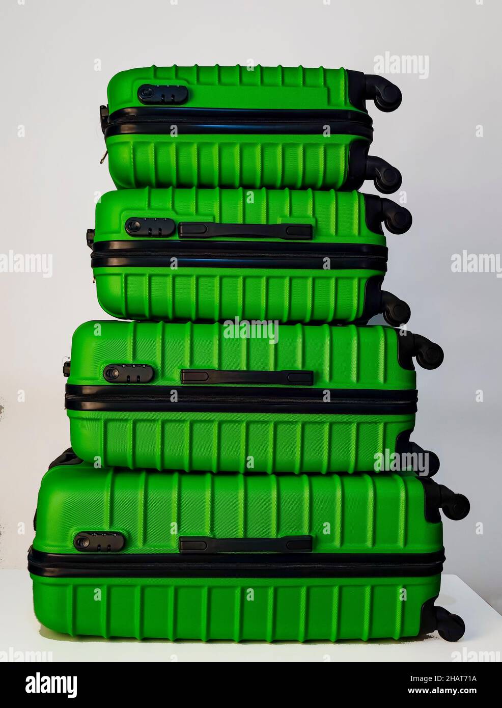 Set of green suitcases for traveling and vacations Stock Photo - Alamy