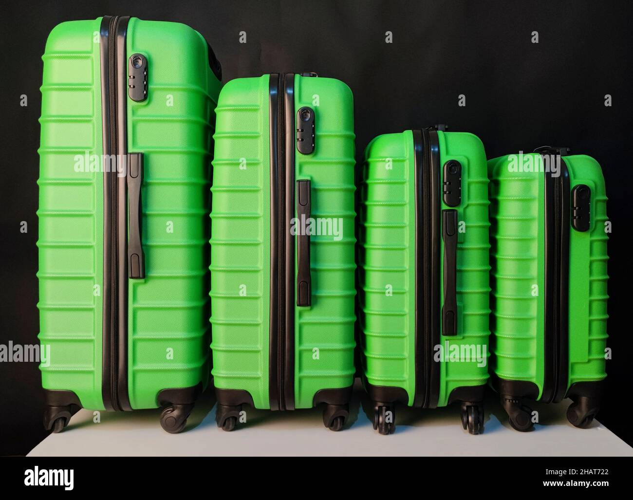 Set of green suitcases for traveling and vacations Stock Photo - Alamy