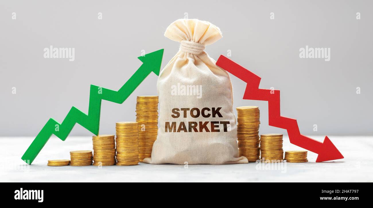 Stock market. Money bag with coins and up and down arrows Stock Photo ...