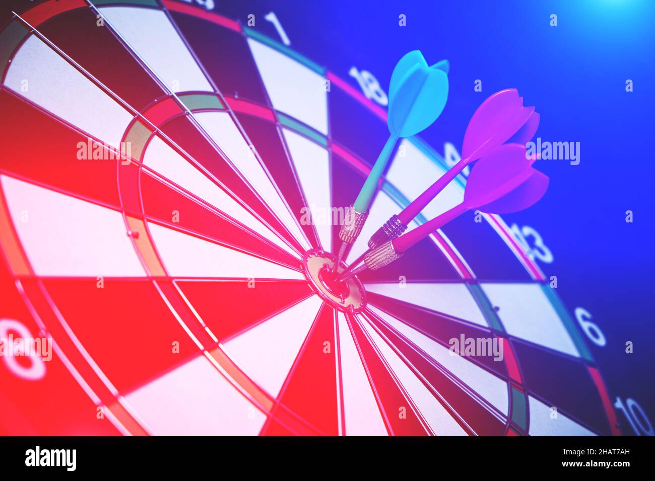 Dartboard with three darts hitting straight at target Stock Photo - Alamy