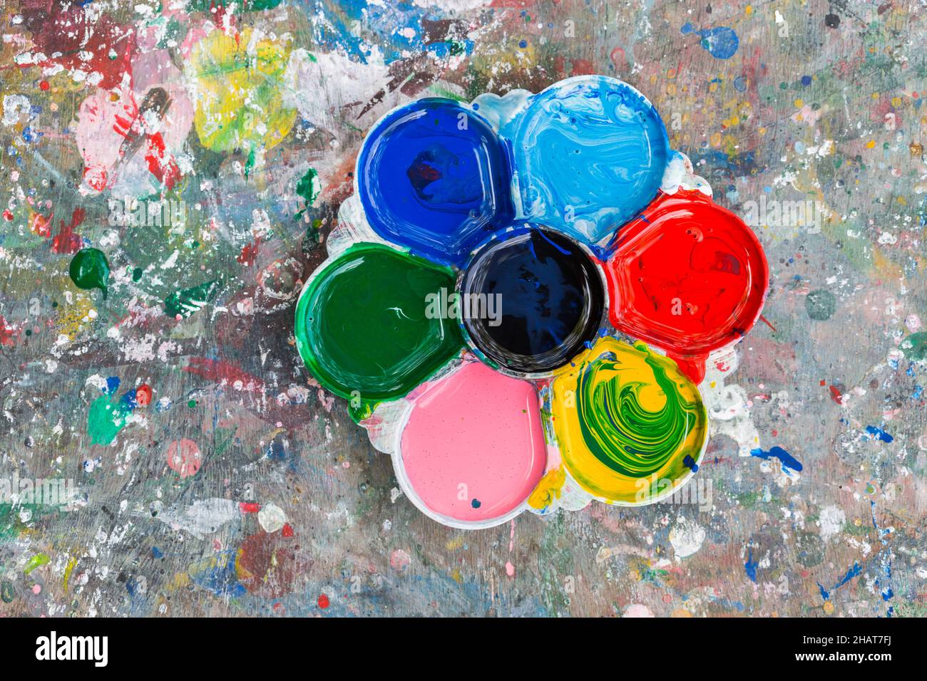 Photo of a artists palette loaded with various colour paints on the ...