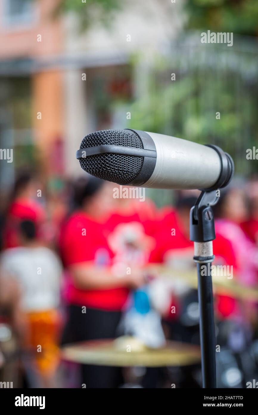 Close up of microphone in public place with blur background Stock Photo ...