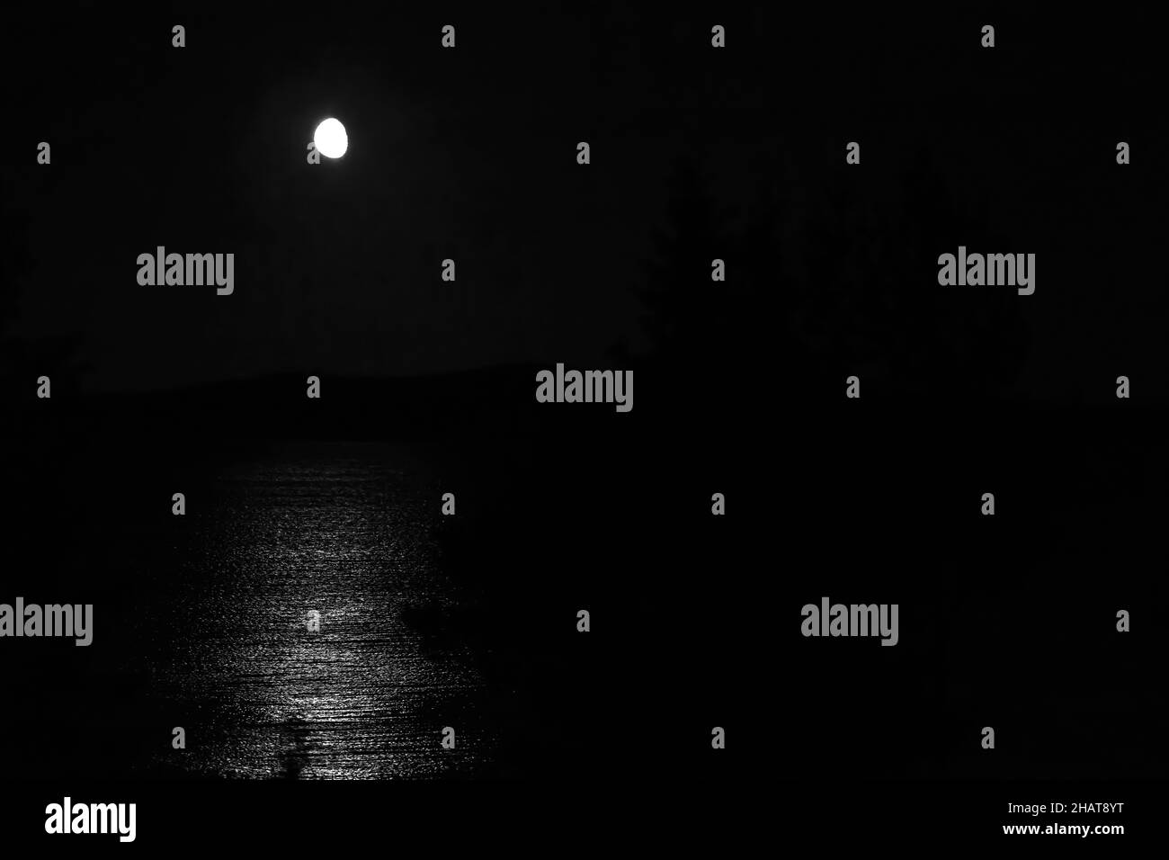 Moon over the ocean along the Baltic Sea. Reflection in the water ...