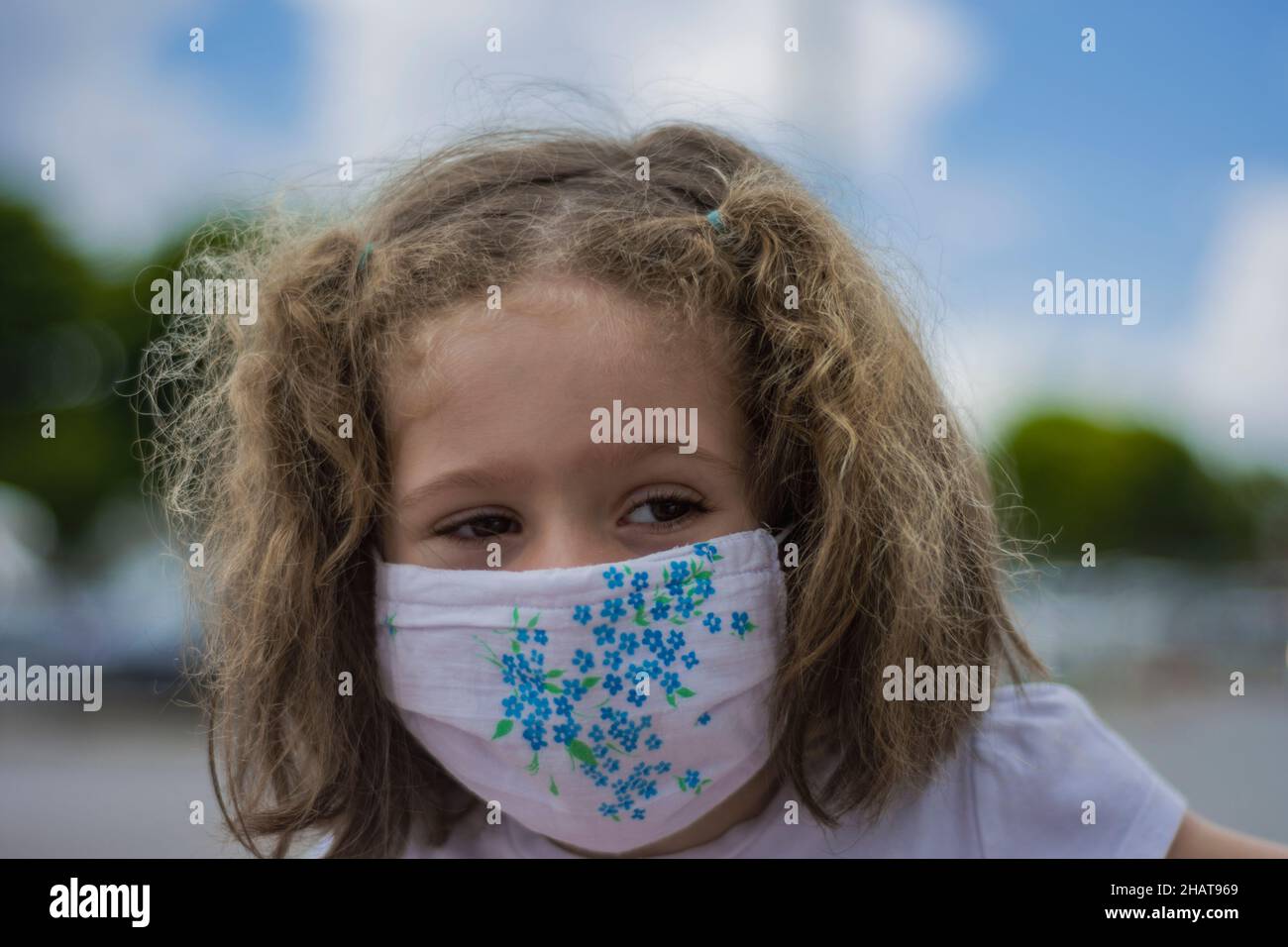 Little sweety girl wear masks to protect against dust and viruses, the ...