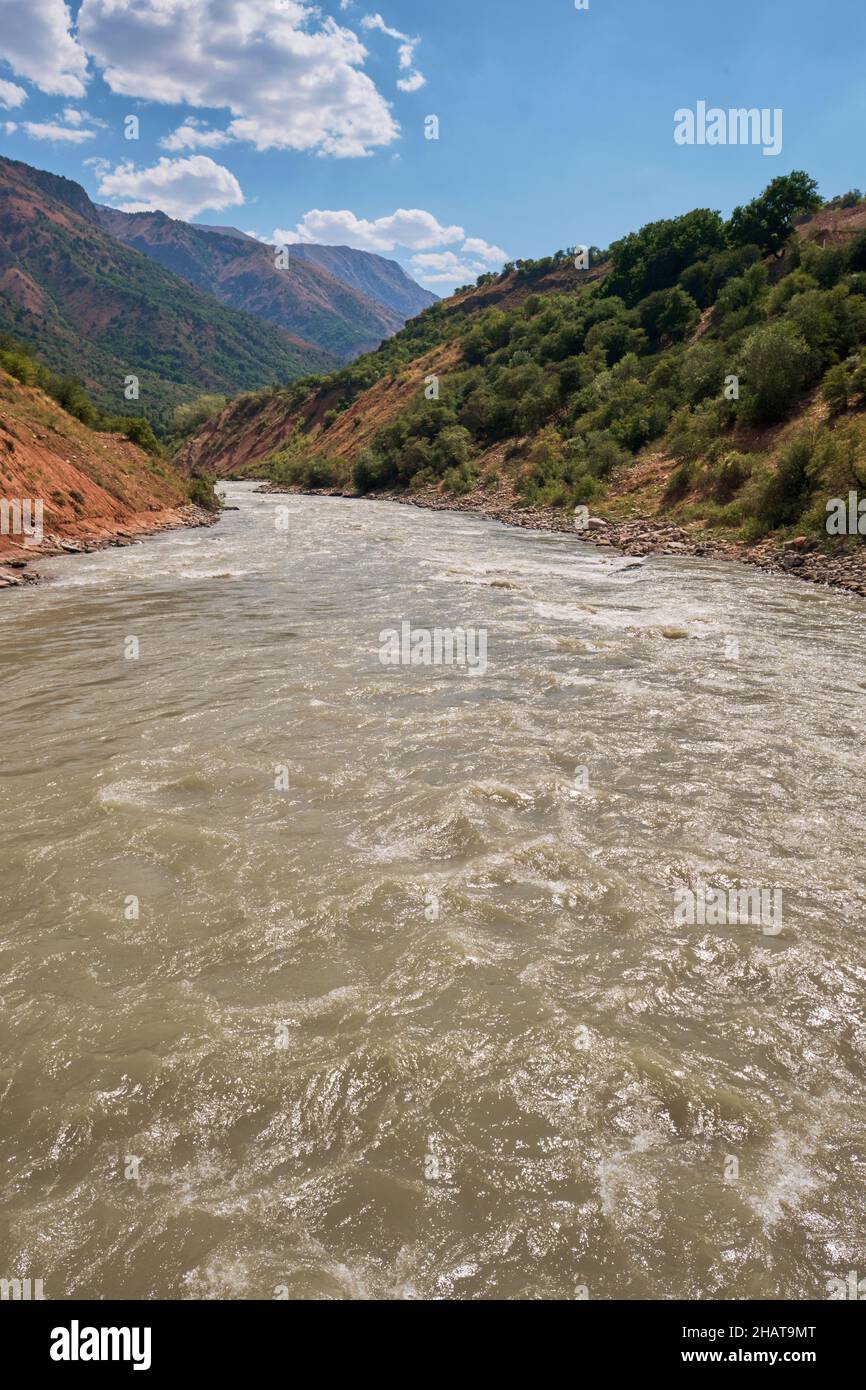 Rushing clean waters of the Pskem river, passing through moutains. In ...
