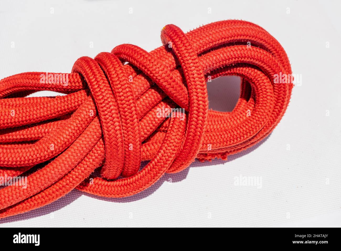 Yachting rope on ship deck. Mooring rope red color on the sailing boat ...