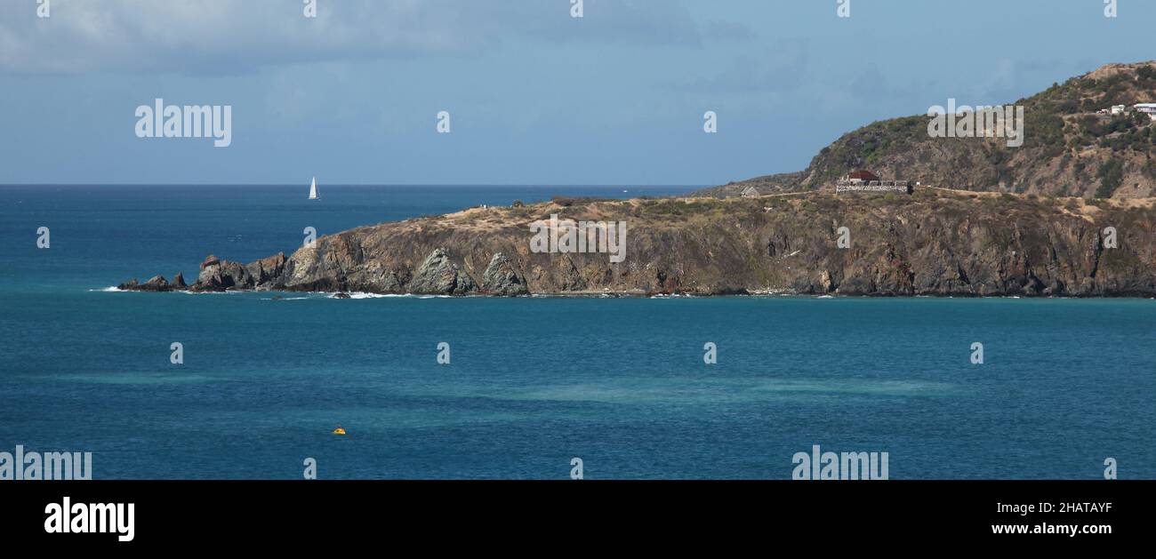 Beautiful view of the rocky coast and the calm sea water Stock Photo ...
