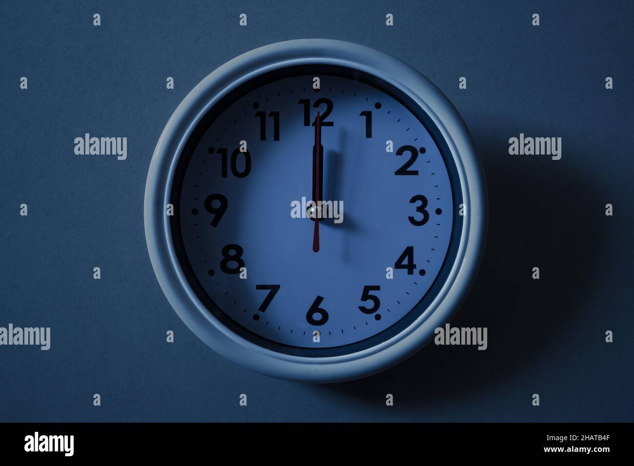 a Wall clock at midnight Stock Photo - Alamy