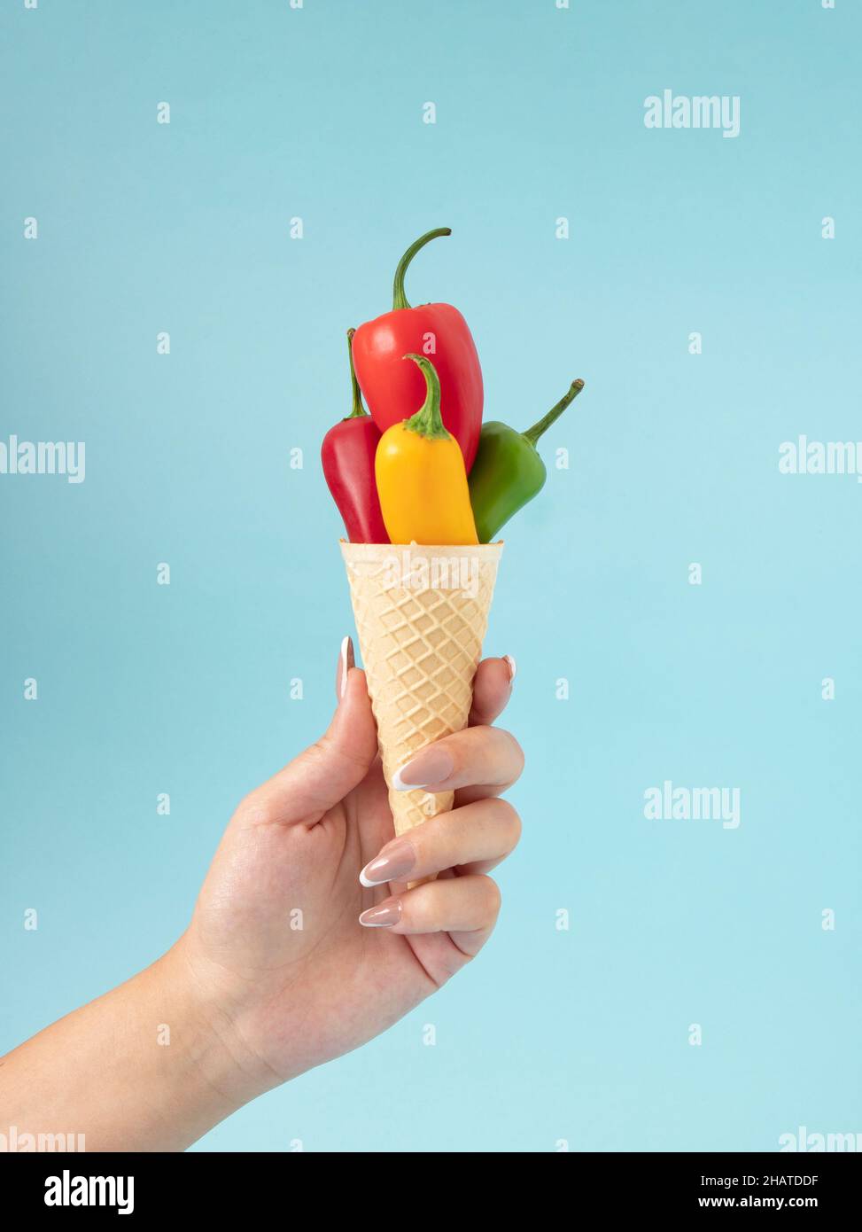 Creative concept of ice cream made of chili pepper. Cornet with fresh ...