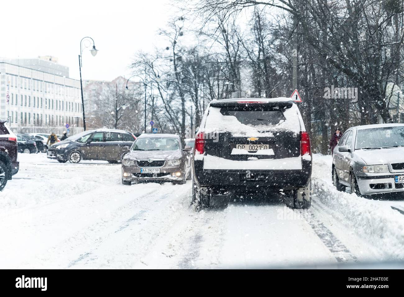 Scenic view traffic city jam at crossroad dirt snow covered slippery ...