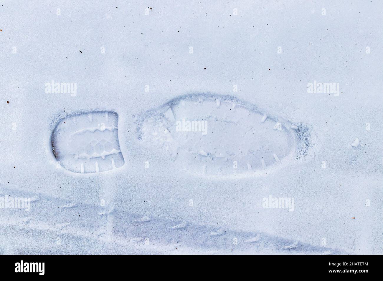 Boot track on thin first snow in winter. Winter concept Stock Photo - Alamy