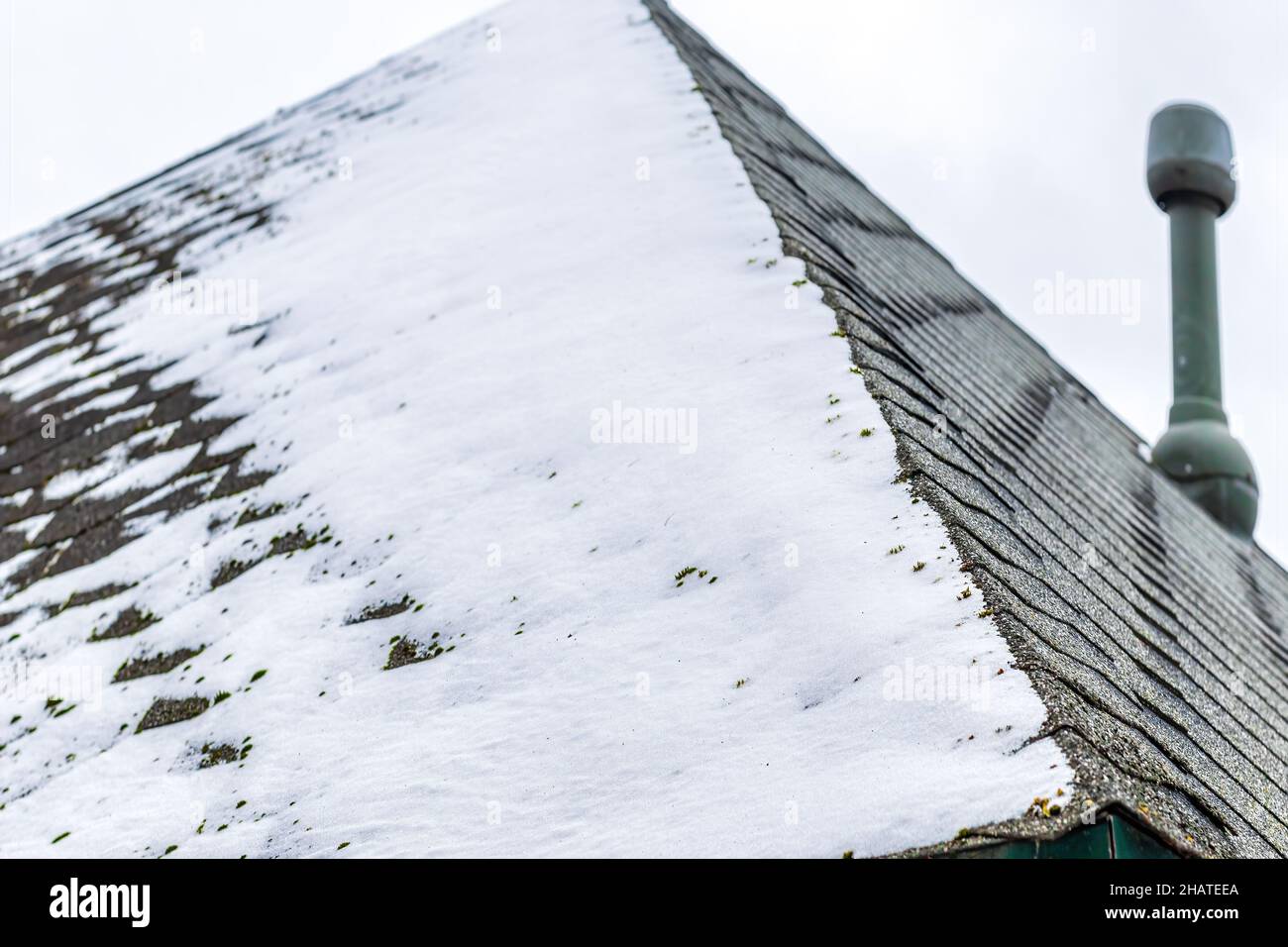 A thin layer of snow on the roof tile. Winter weather concept Stock ...