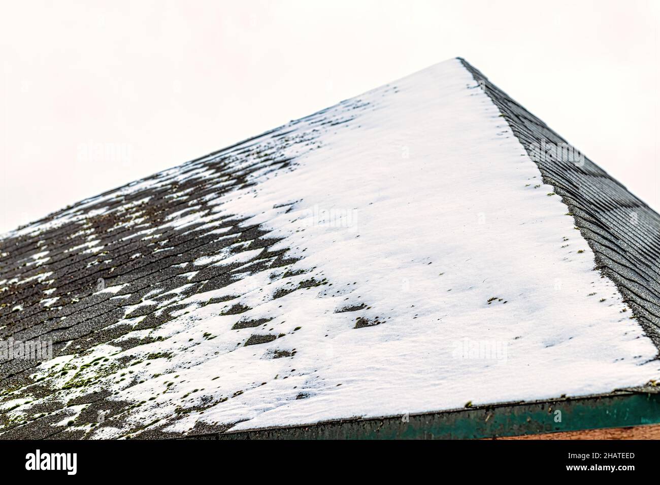 A thin layer of snow on the roof tile. Winter weather concept Stock ...