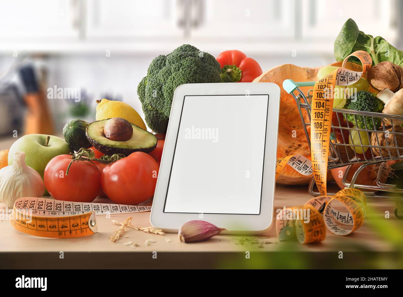 Blank electronic device on kitchen bench for list or digital recipe for ...