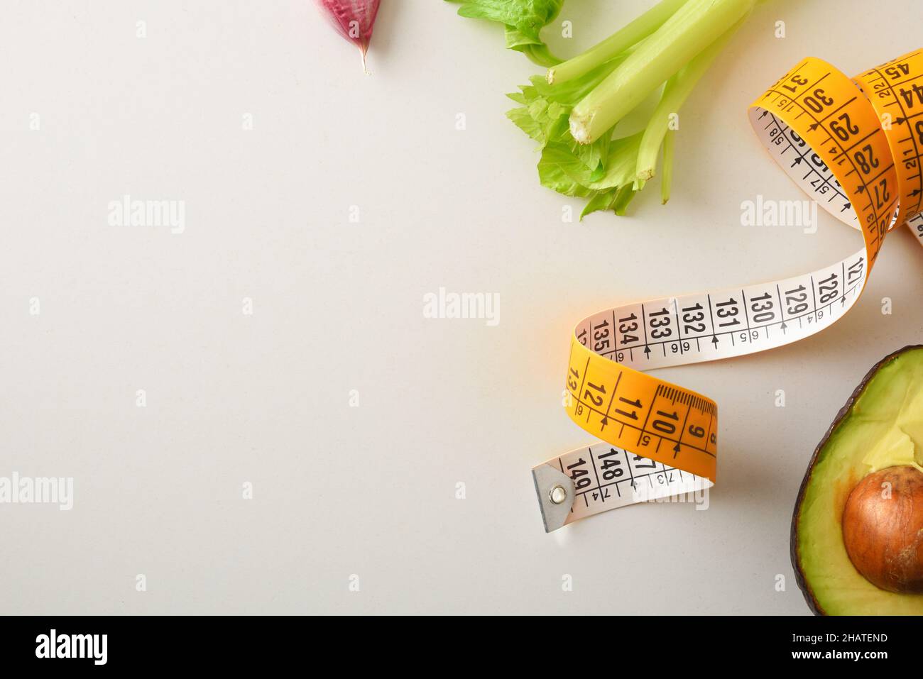Background healthy diet concept with vegetables and measure tape on ...