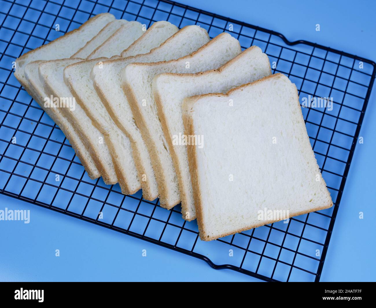 set of toast bread on pastel blue background Stock Photo - Alamy