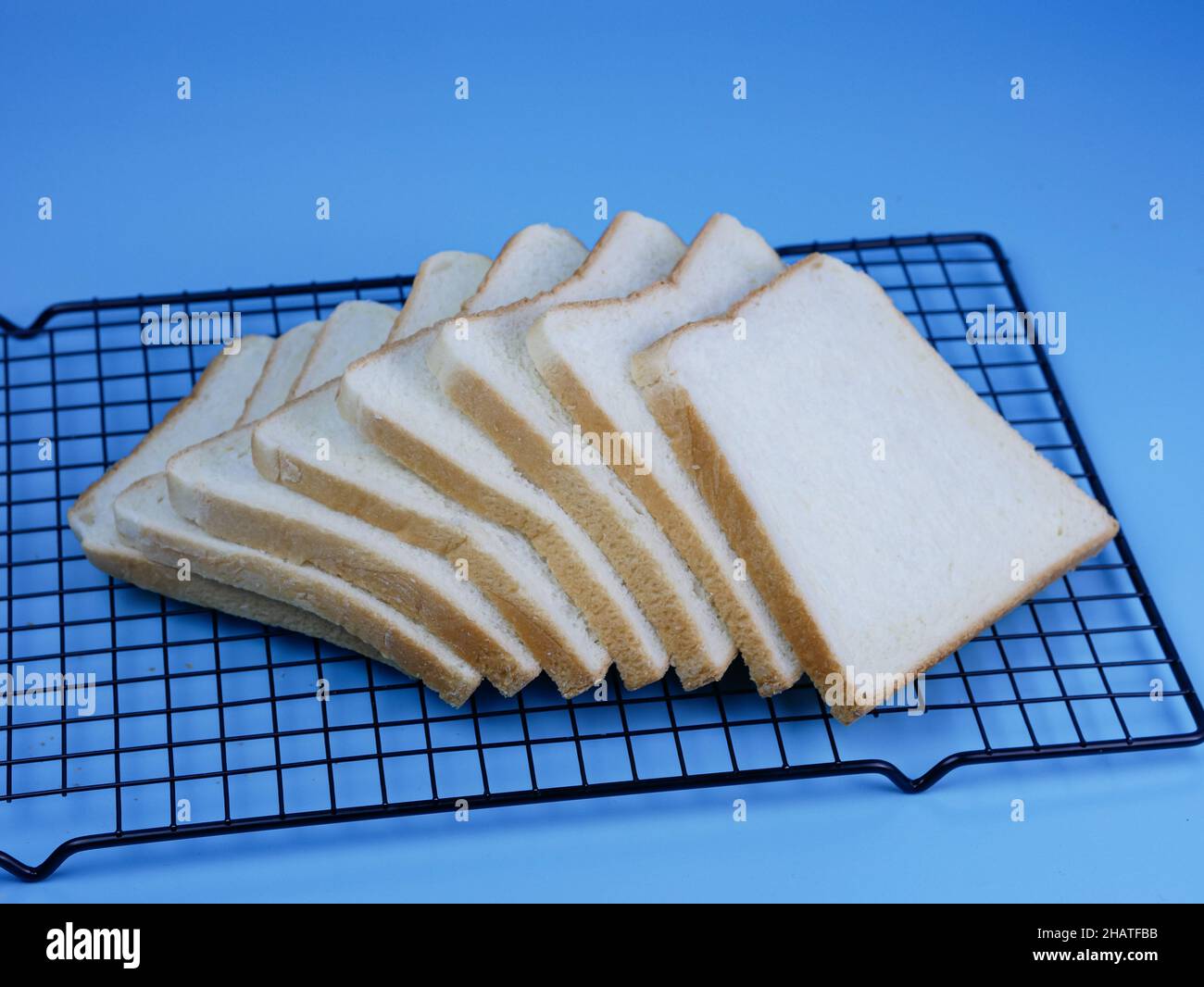 set of toast bread on pastel blue background Stock Photo - Alamy