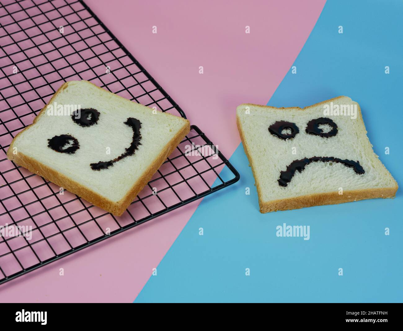 toasted bread with smiley and sad emoticons, for the concept of ...