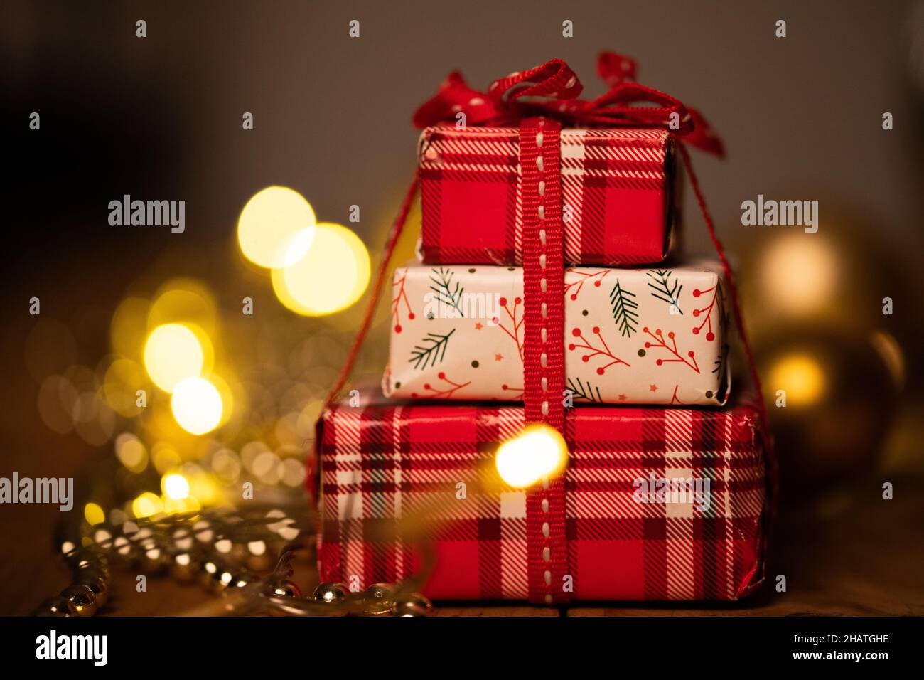 red gift boxes and holiday Christmas lights Stock Photo - Alamy