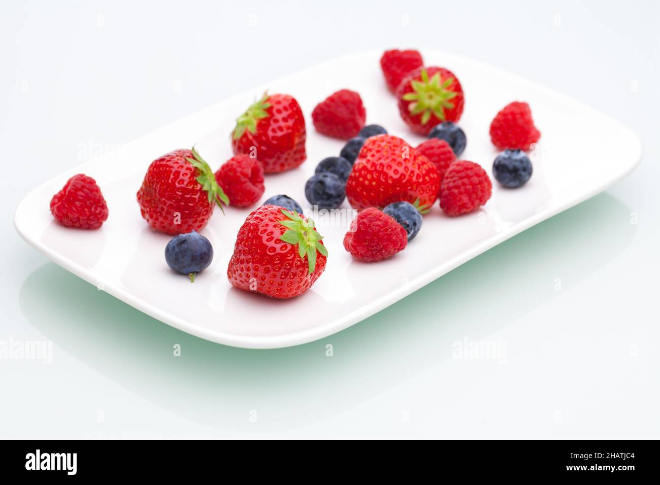 Strawberries, plates, raspberries, blueberries, white, background ...
