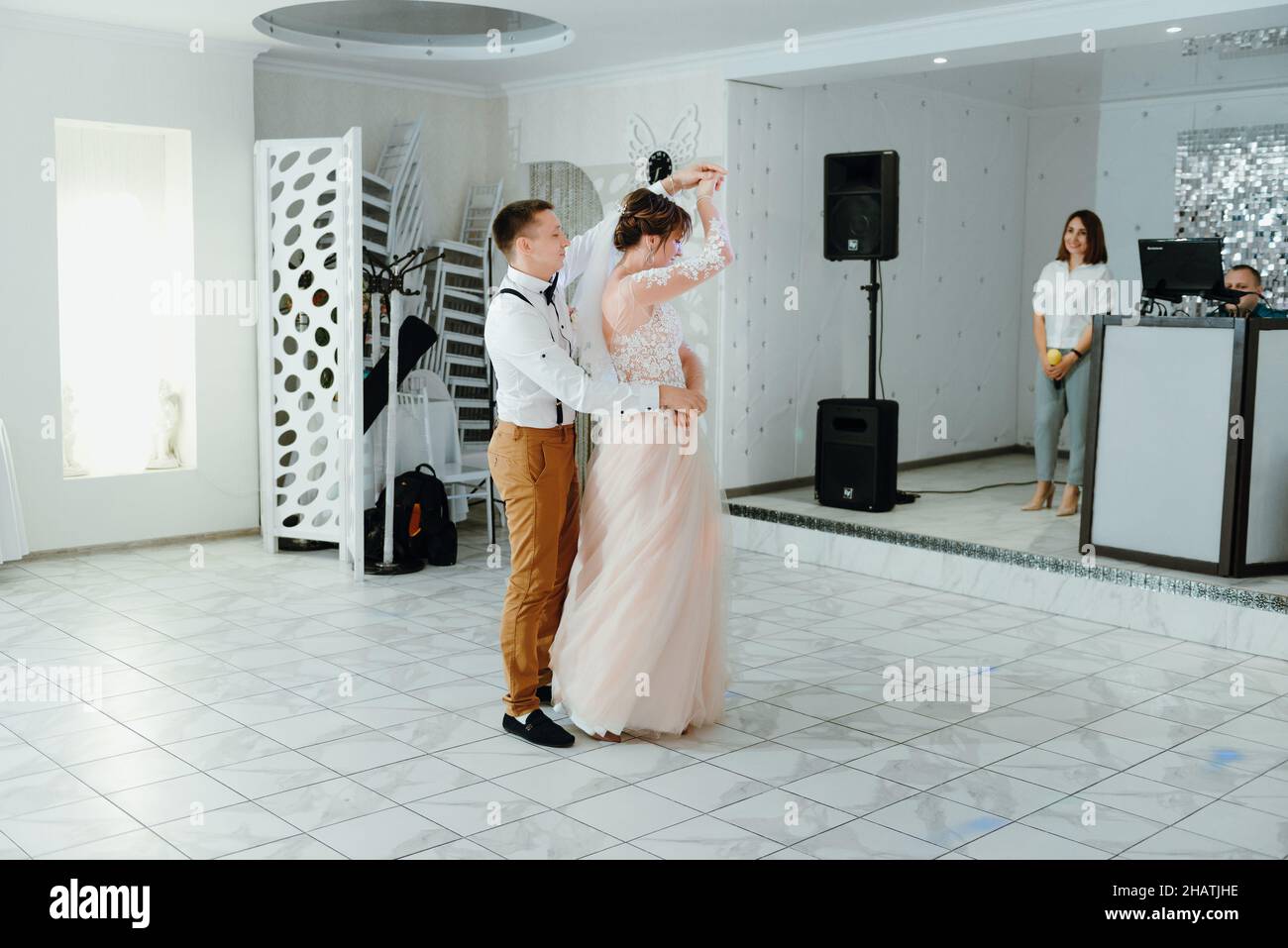 beautiful caucasian couple just married and dancing their first dance ...