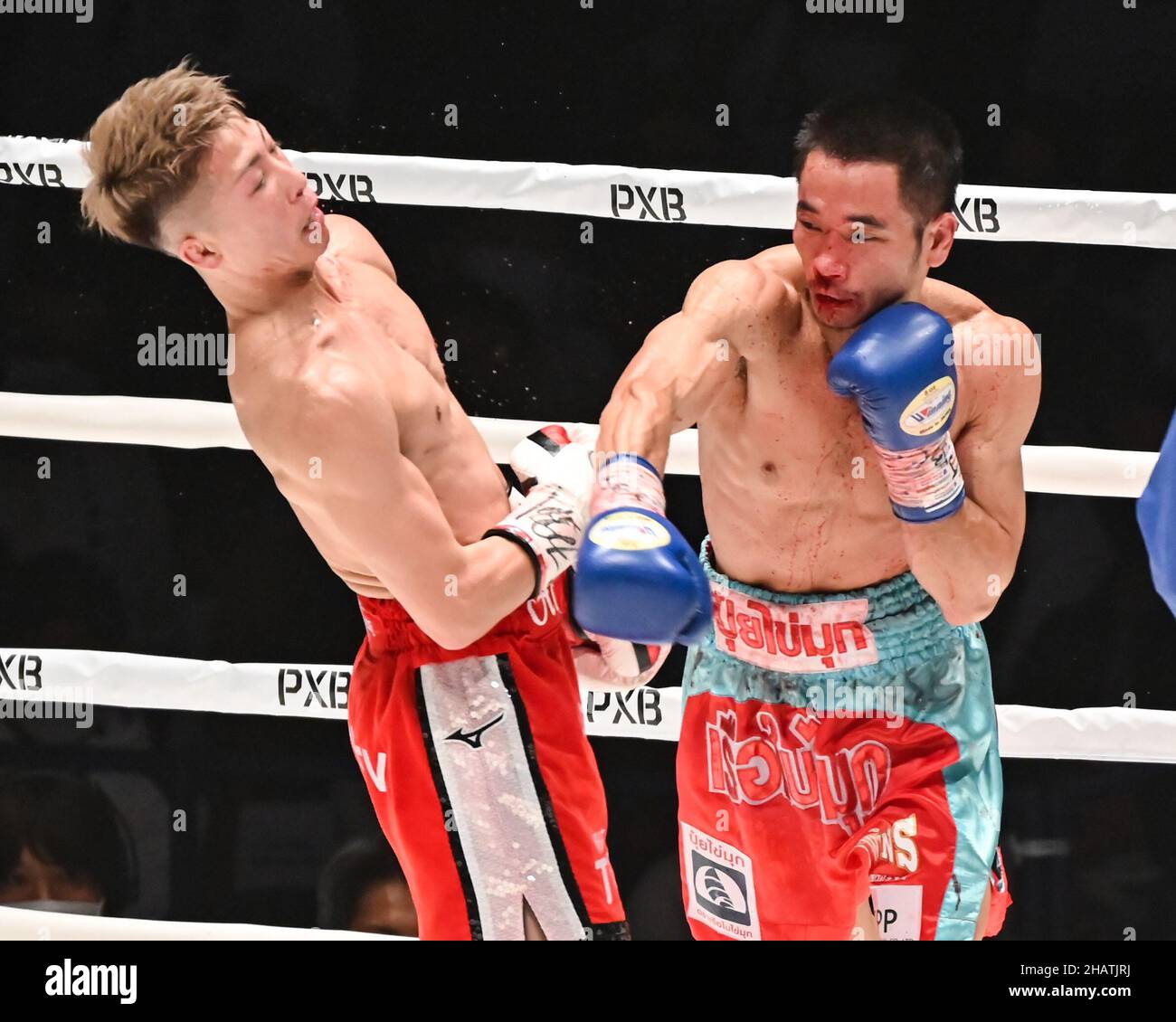 Naoya Inoue (white gloves) of Japan and Aran Dipaen (blue gloves) of ...