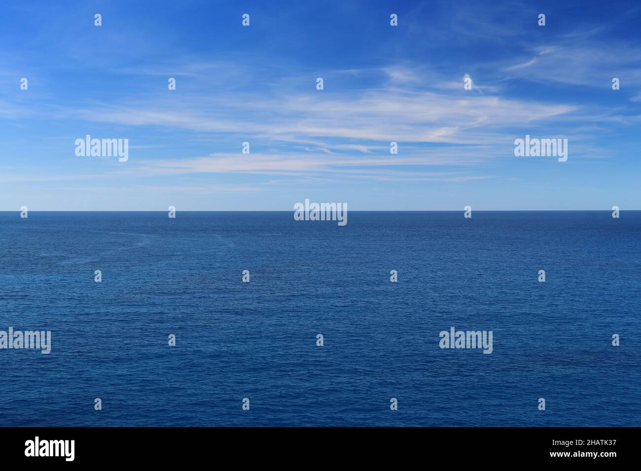Tranquil scenery of the horizon on the azure ocean and the blue sky in ...
