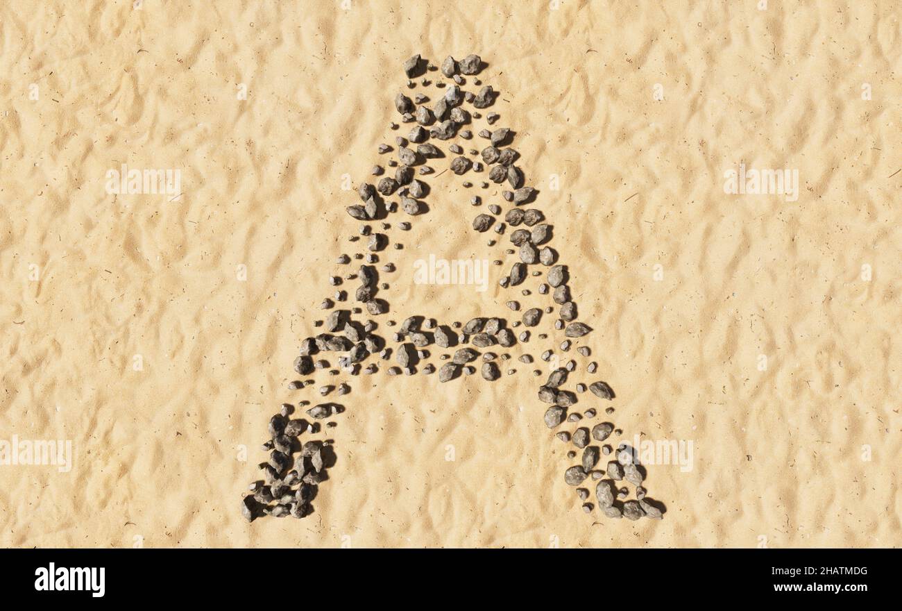 Concept or conceptual stones on beach sand handmade symbol shape ...