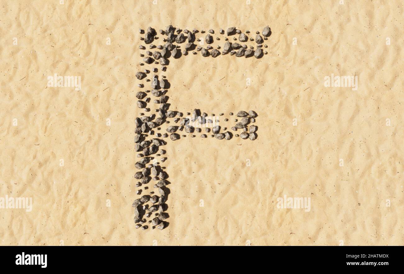 Concept or conceptual stones on beach sand handmade symbol shape ...