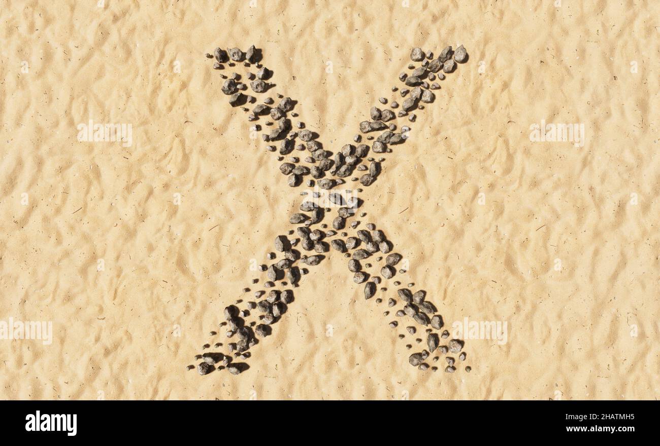 Concept or conceptual stones on beach sand handmade symbol shape ...