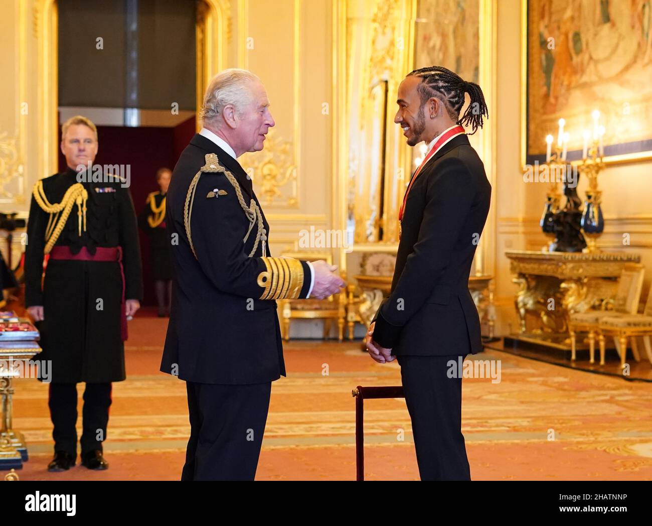 Sir Lewis Hamilton is made a Knight Bachelor by the Prince of Wales at ...