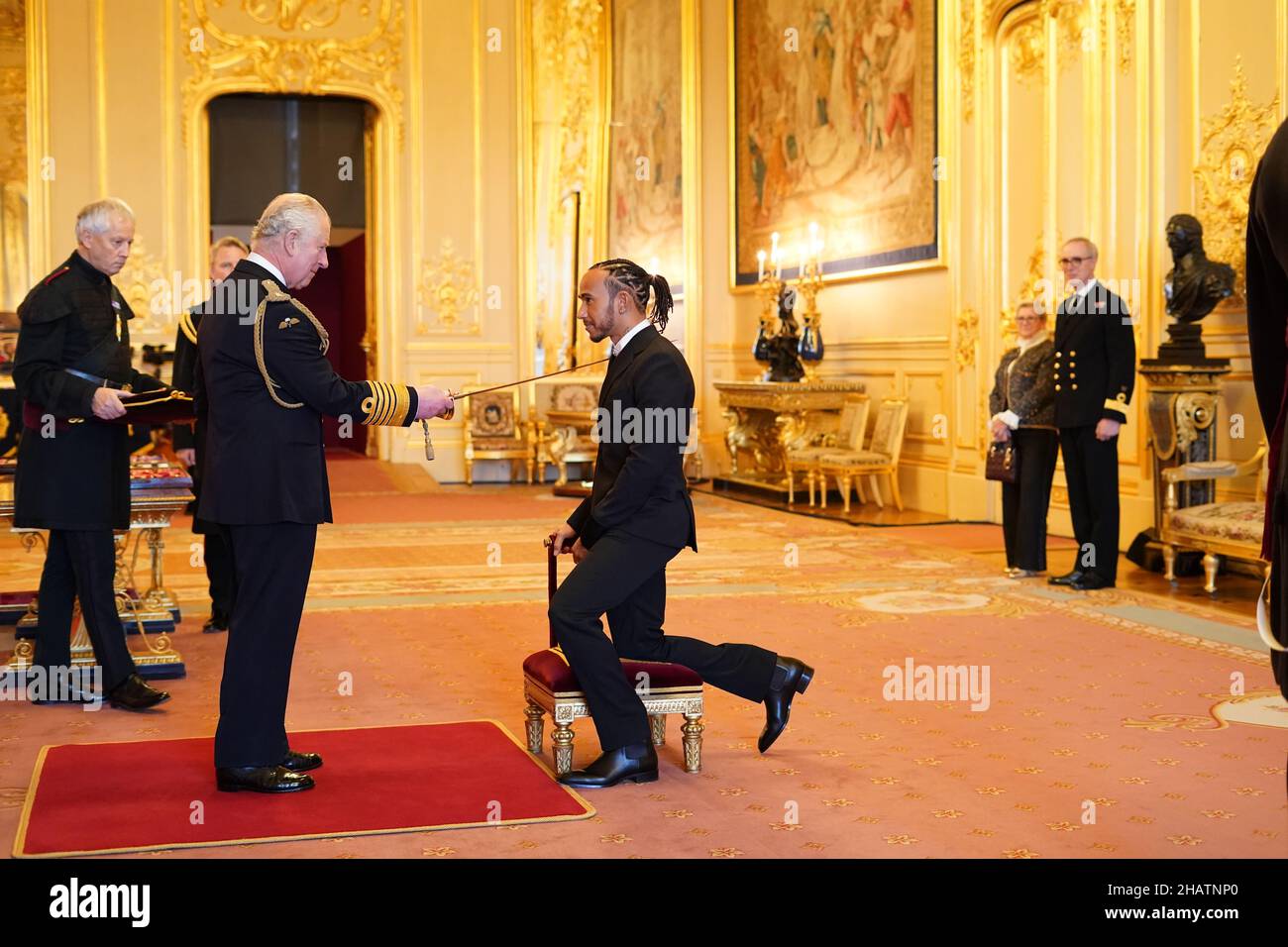 Sir Lewis Hamilton is made a Knight Bachelor by the Prince of Wales at ...