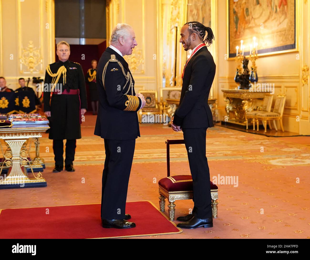 Sir Lewis Hamilton is made a Knight Bachelor by the Prince of Wales at ...