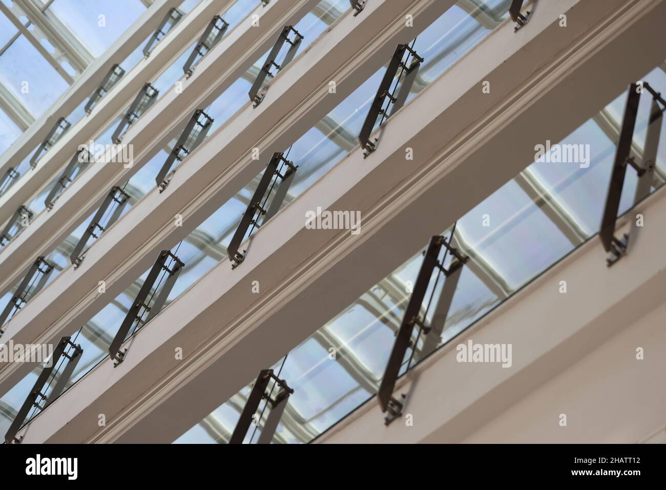 Facade of multistorey building with glass balconies closeup background ...