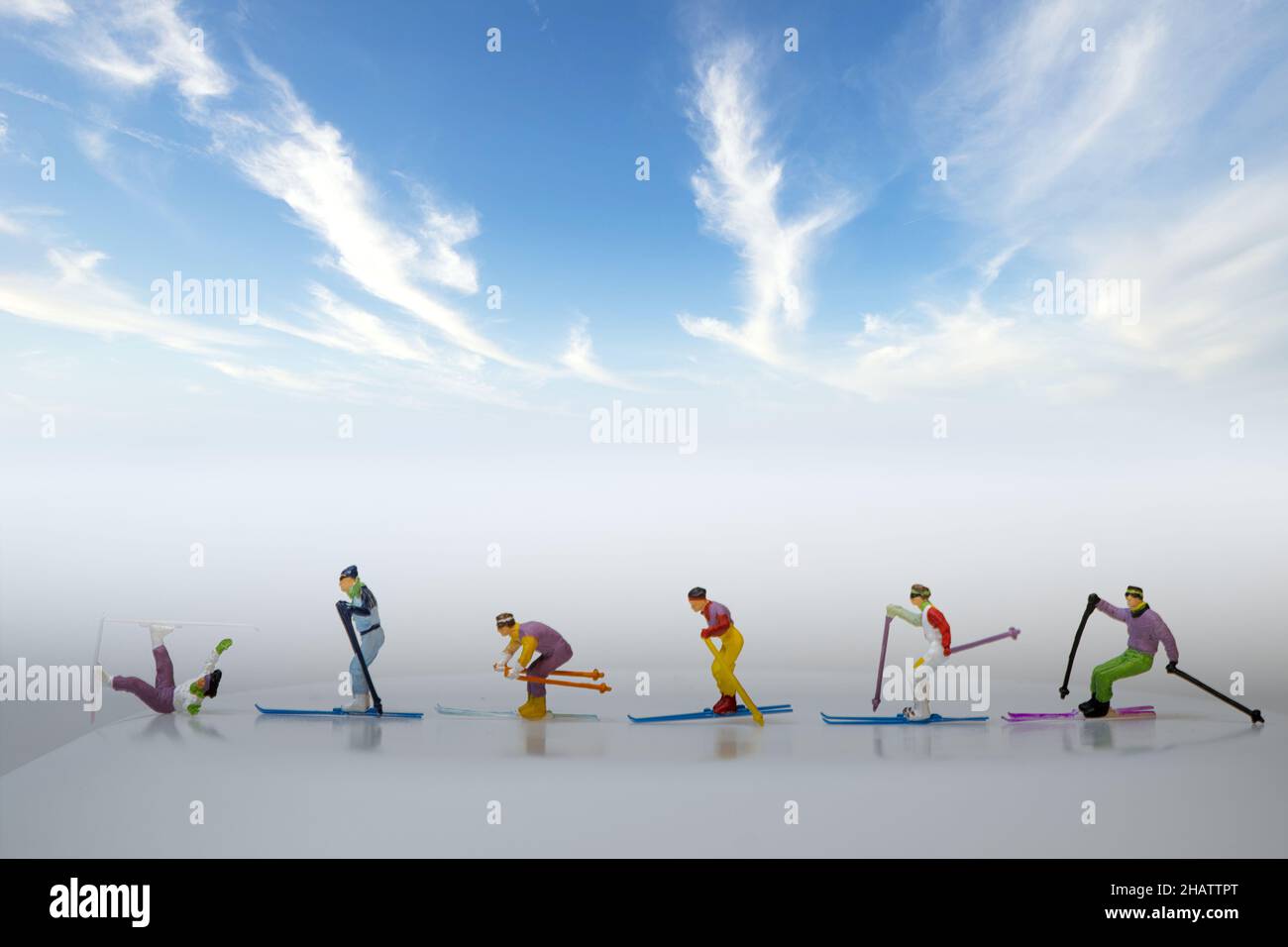 Group of miniature figures of skiers on a white background Stock Photo ...