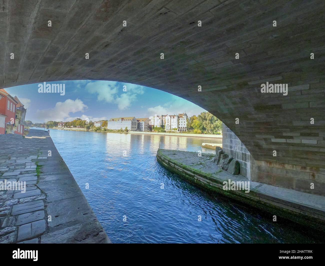 Arched bridge over a canal between buildings Stock Photo - Alamy