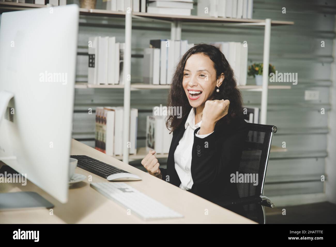 Happy cheerful woman sitting and working on monitor, success and ...