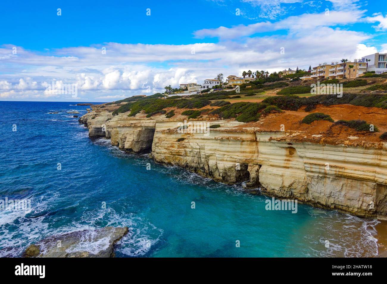 Sea Caves and cliff top villas, near Coral Bay, Paphos, Cyprus Stock ...