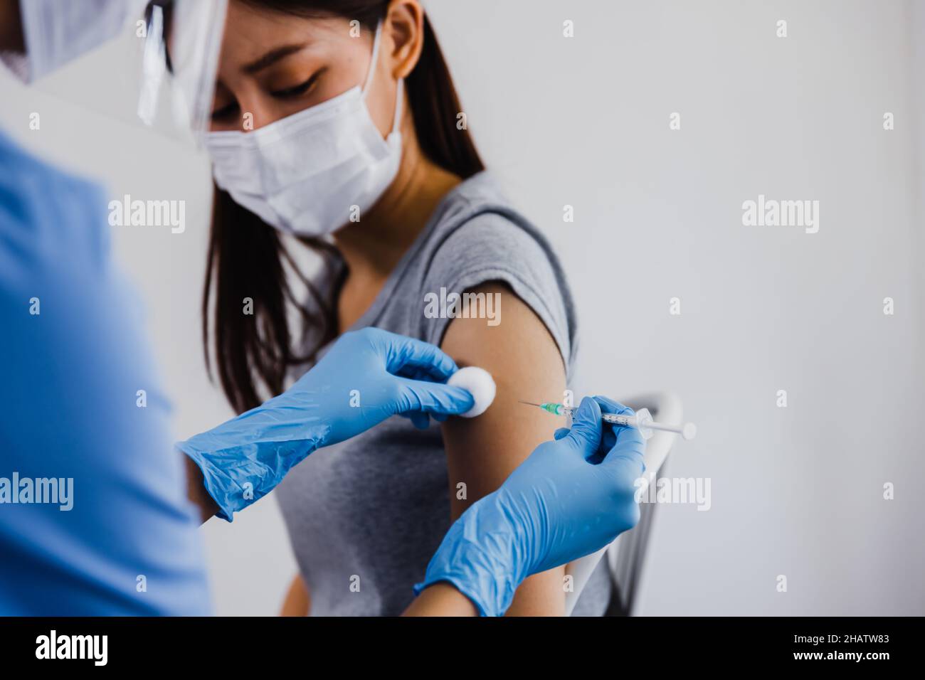 Asian woman doctor holding syringe and using cotton before make ...