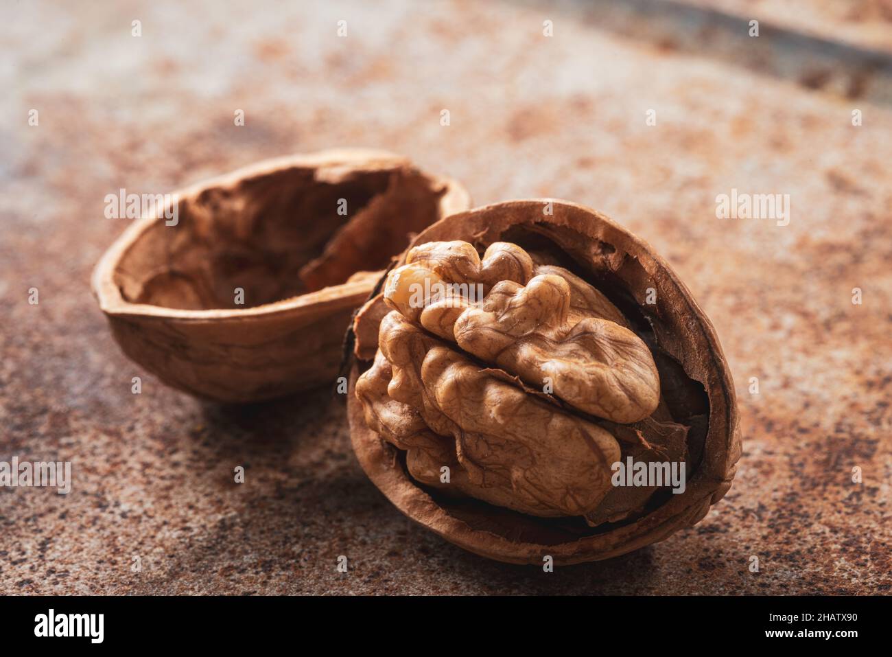 single walnut on a rustic background Stock Photo - Alamy