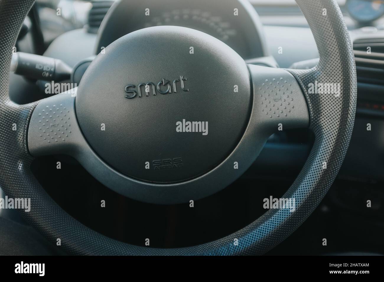 Smart sign on the steering wheel of the car Stock Photo - Alamy