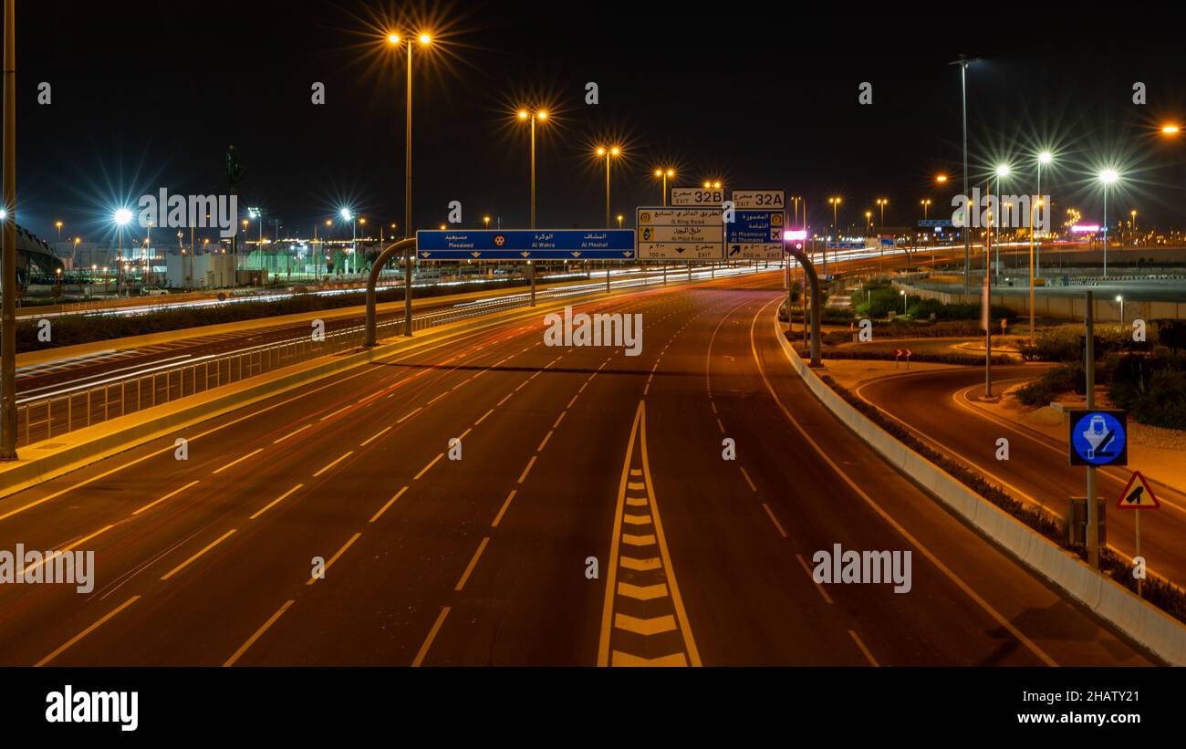 Doha, Qatar- December 12,2021 : Qatar highway with many light trails ...
