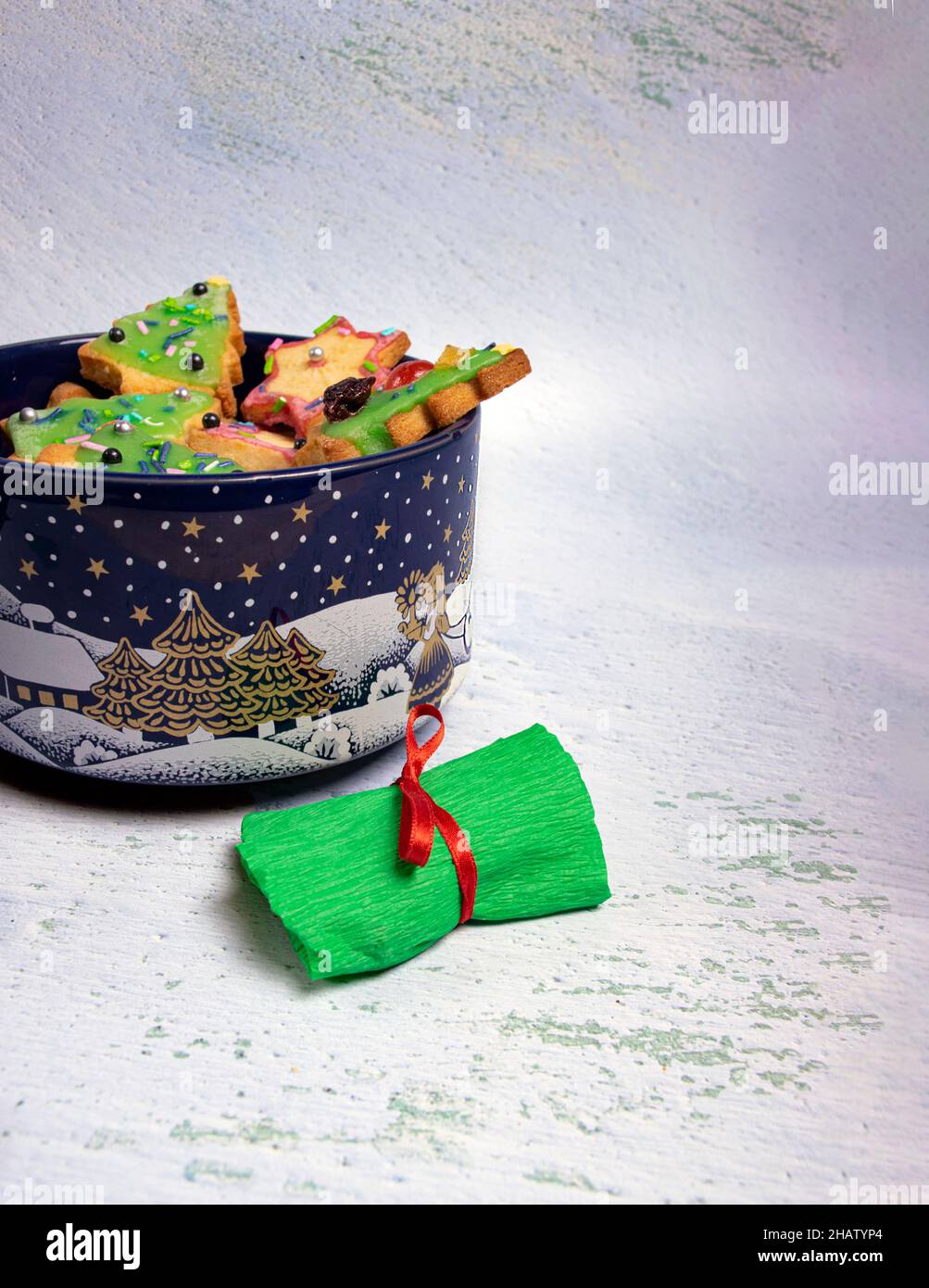 A ceramic bowl full of biscuits in New Year’s shapes Stock Photo - Alamy