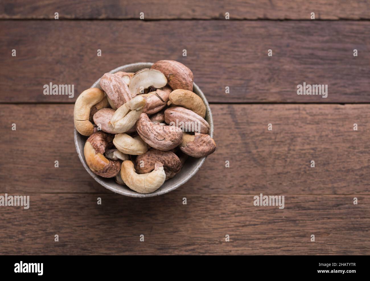 Cashews nuts with shells,homemade roasted process in ceramic bowl on ...